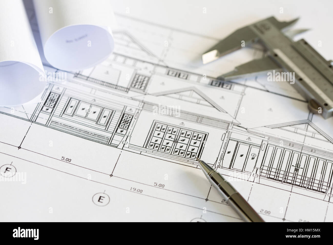 Construction plans and drawing tools on blueprints Stock Photo - Alamy