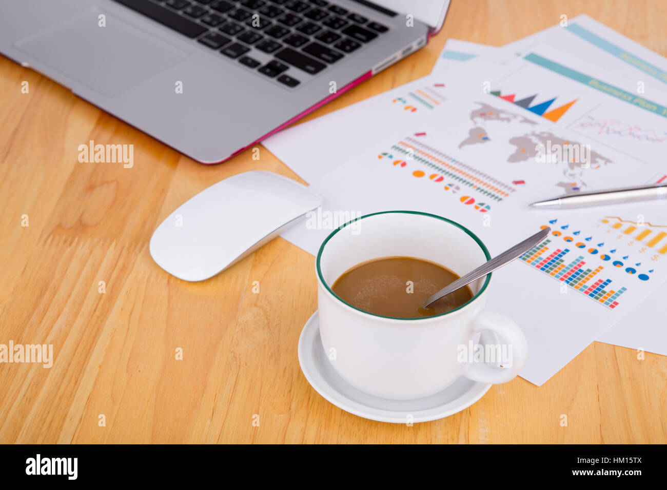 Financial chart on the table with laptop, coffee and pen Stock Photo ...
