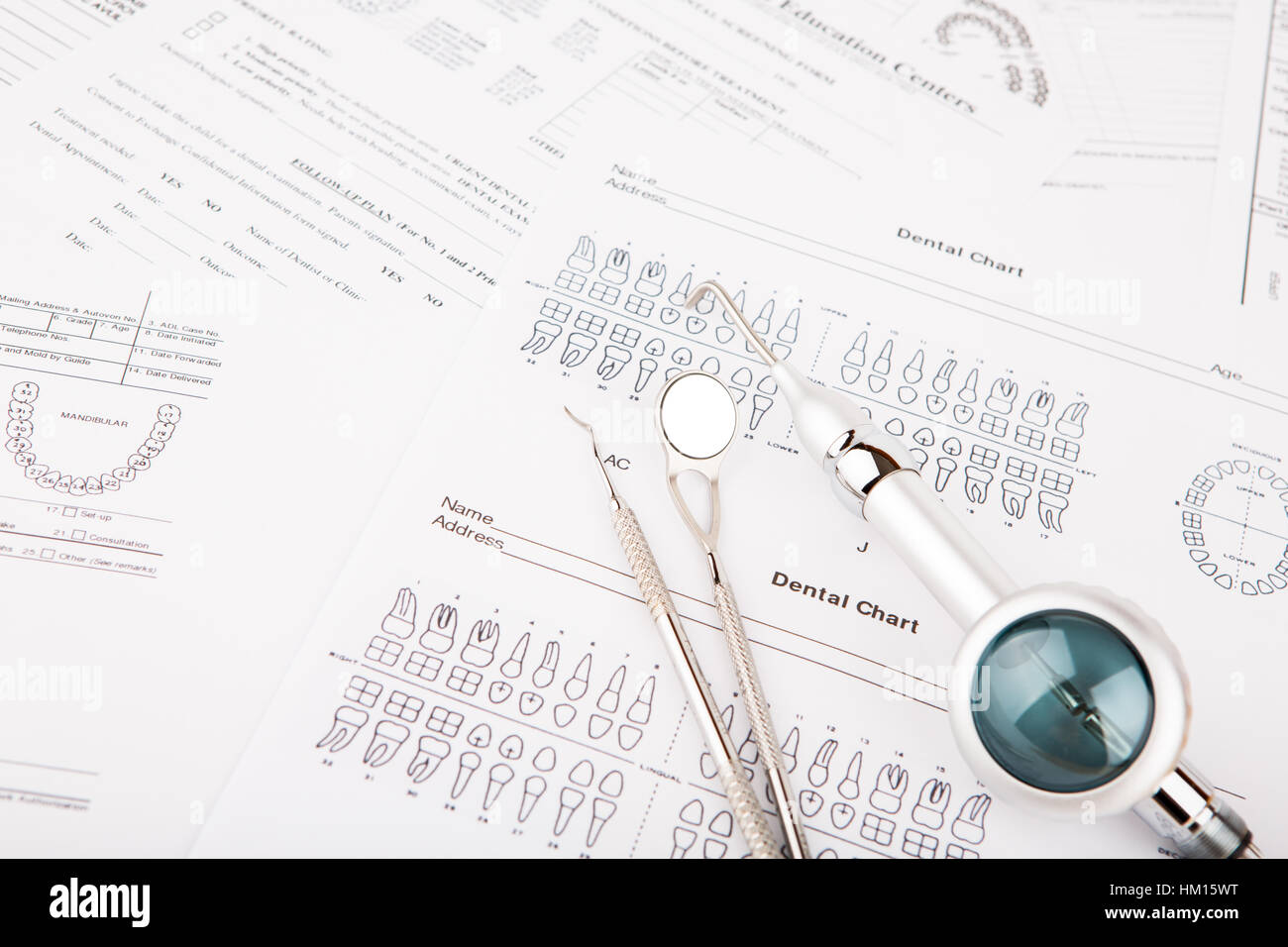 Dental tools and equipment on dental chart Stock Photo - Alamy