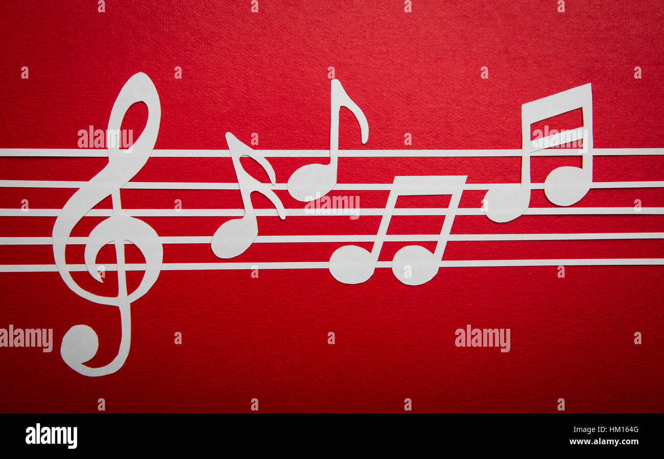 Paper cut of music note on staves with copy space for text or design ...