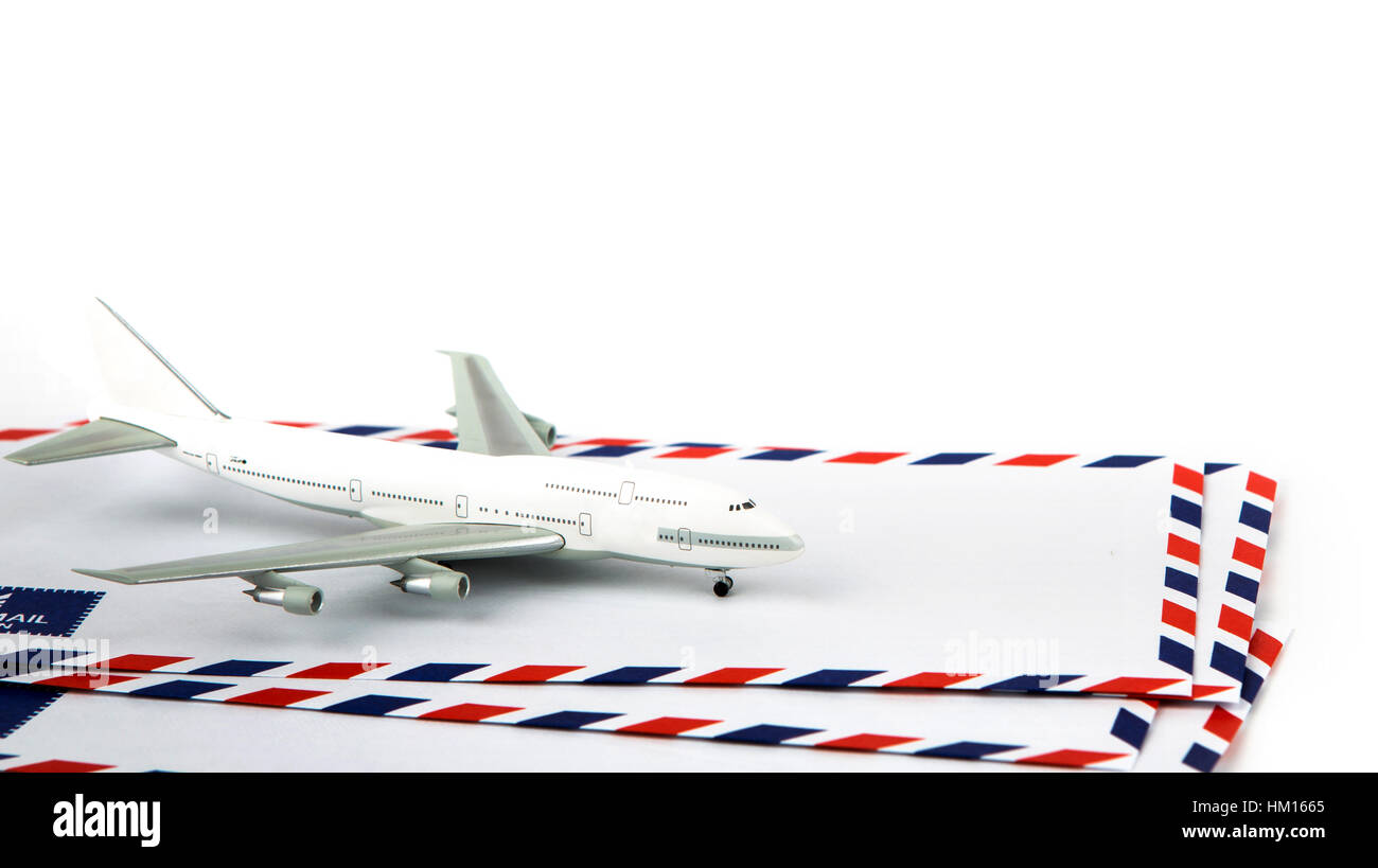 Airmail envelope with model airplane Stock Photo - Alamy
