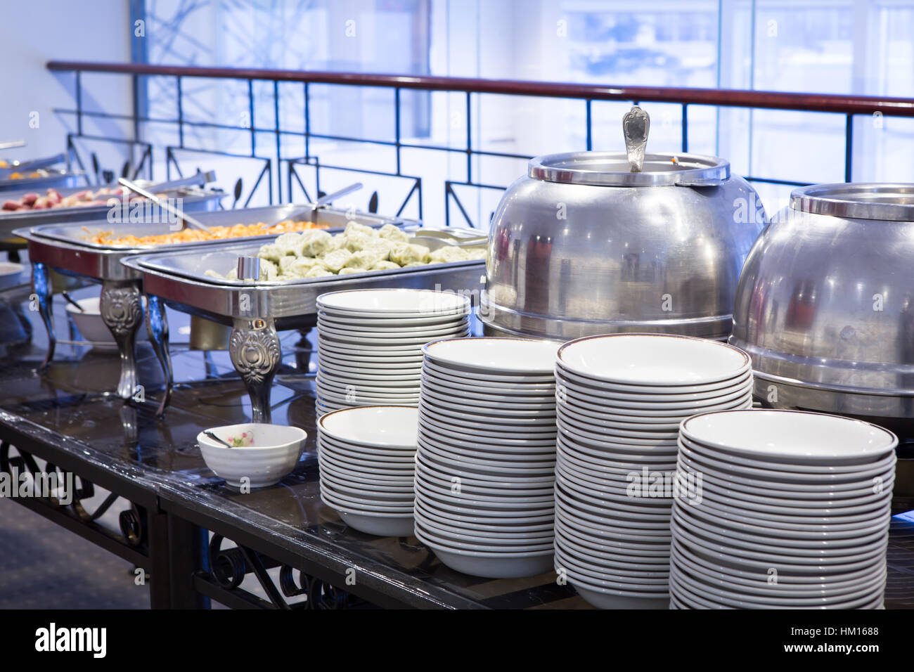 Buffet Table with dishware Stock Photo - Alamy