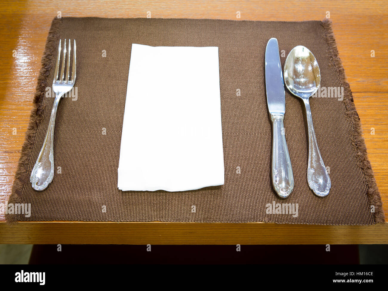 Table appointments- fork,knife,spoon, silk napkin Stock Photo - Alamy