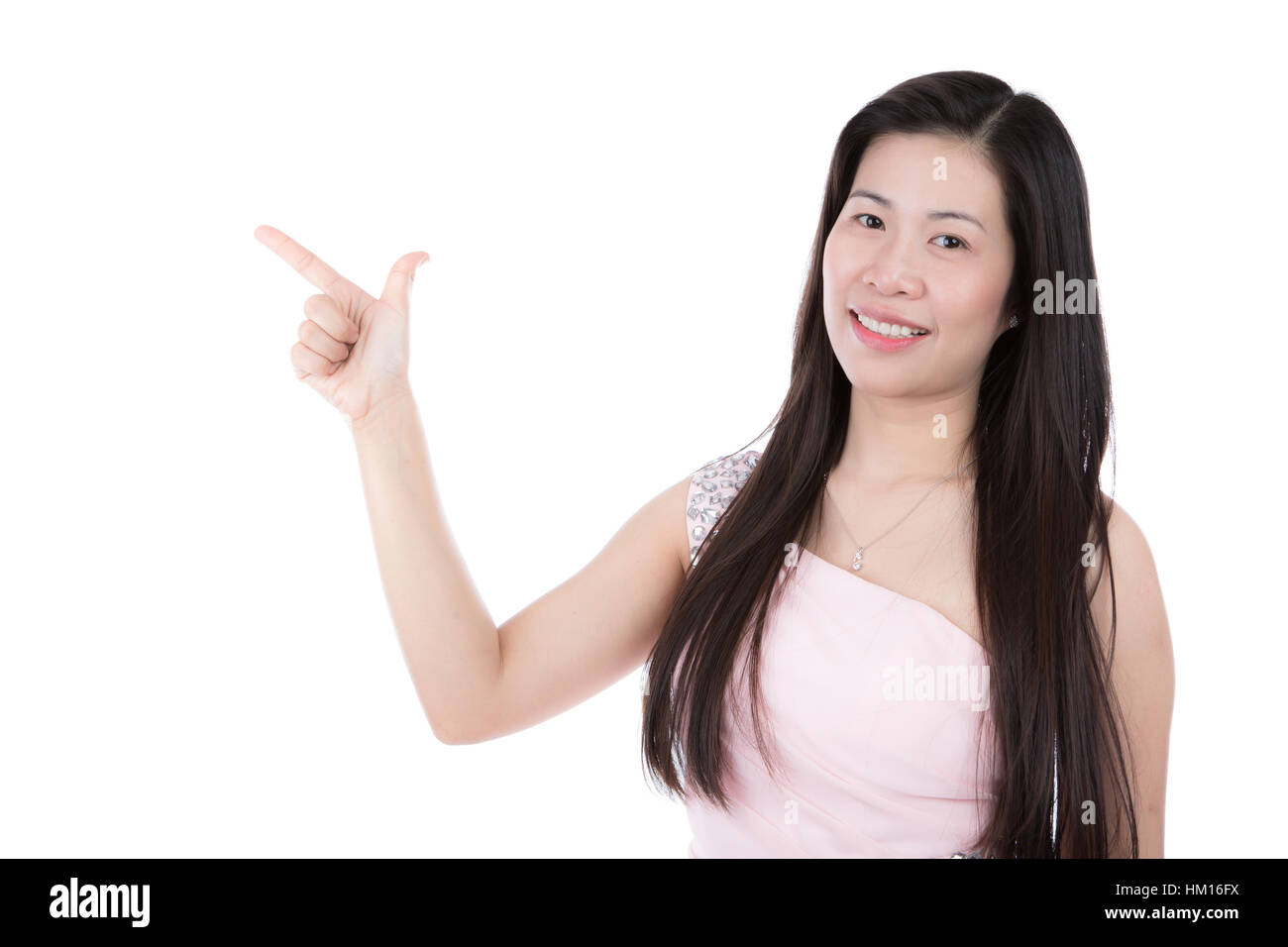 Portrait of young woman pointing up isolated white background Stock ...