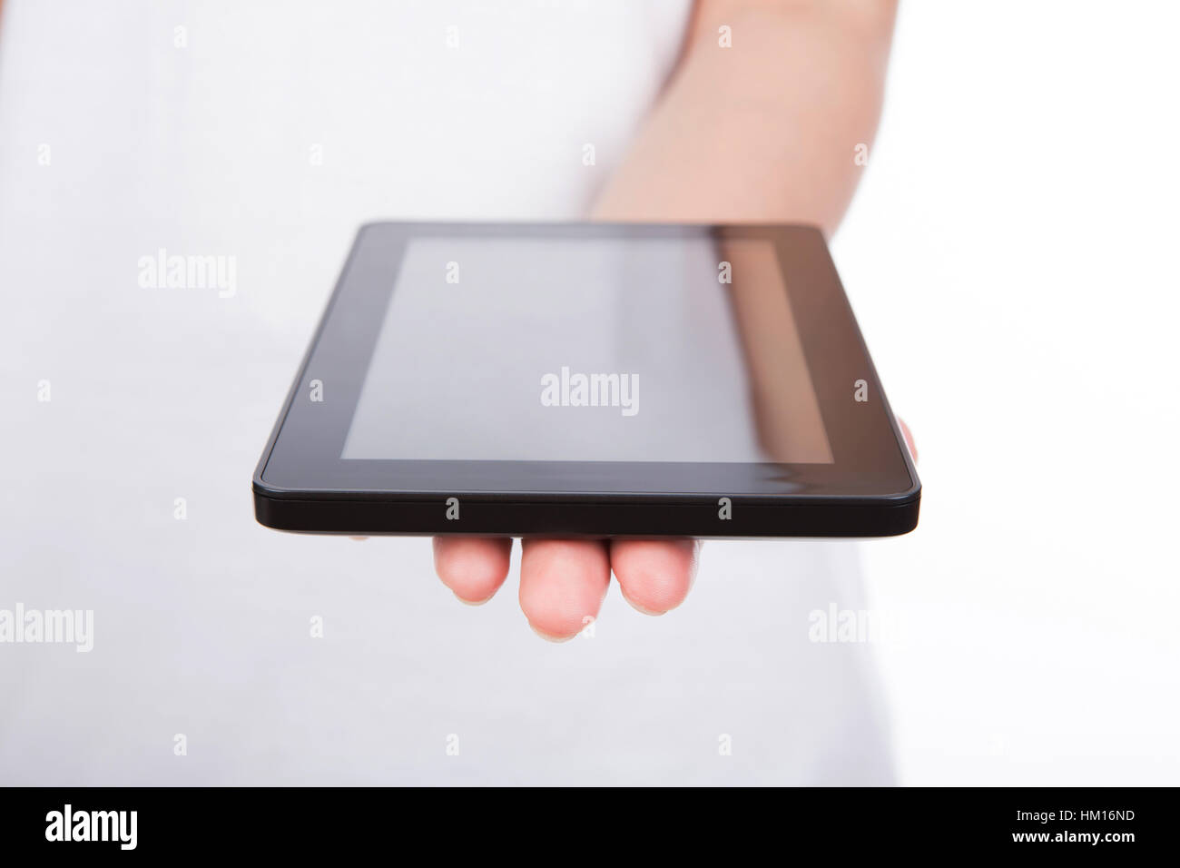 Woman hand using a touch screen device against white background Stock ...