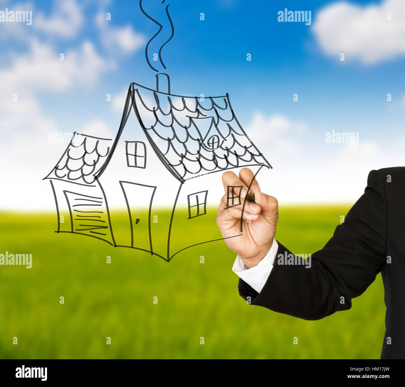 Business hand with pen drawing a house Stock Photo - Alamy
