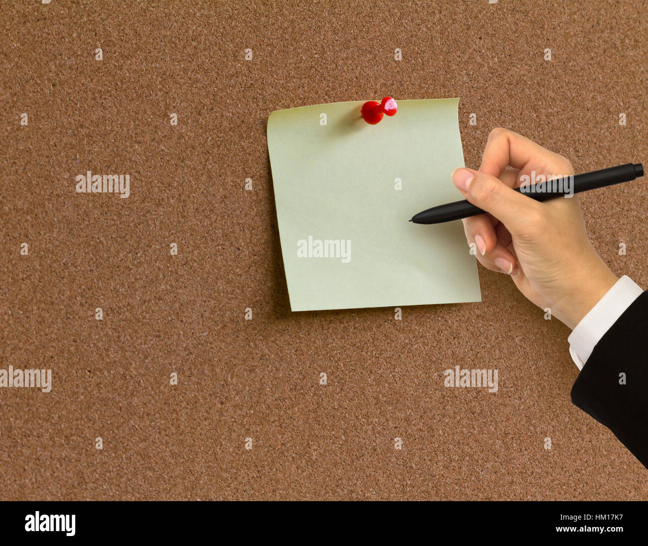 Hand writing in paper note on cork board background Stock Photo - Alamy