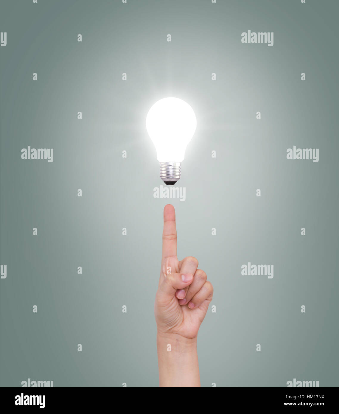 Hand point to Light bulb Stock Photo - Alamy