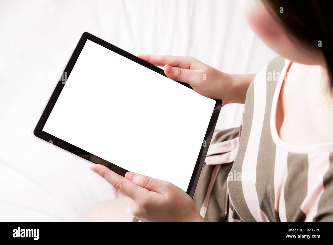 Woman reading the touch screen device Stock Photo - Alamy