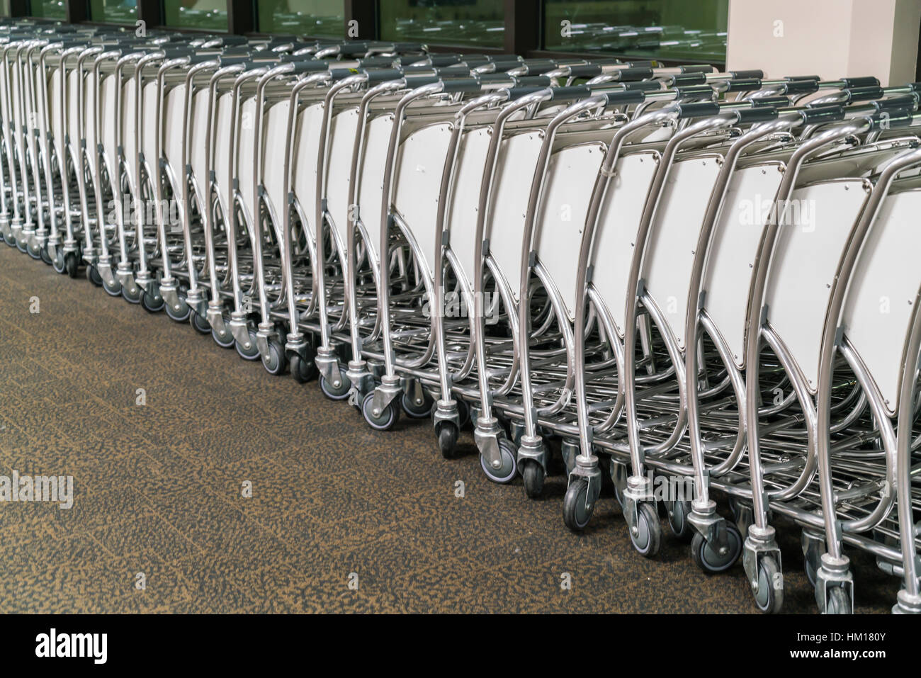 luggage carts at airport terminal Stock Photo - Alamy