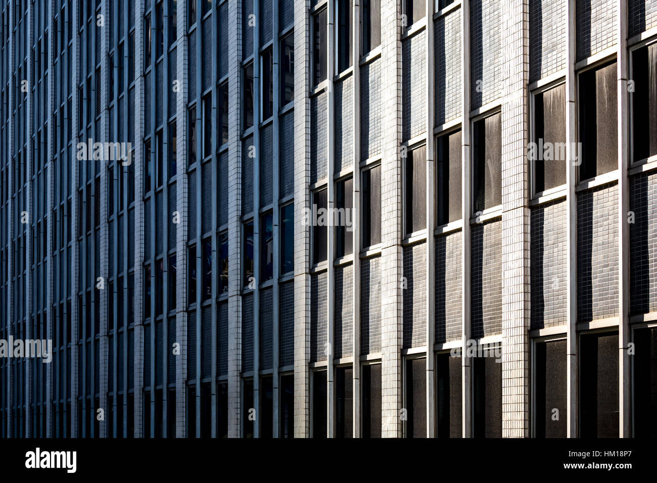 Windows of commercial building in Hong Kong Stock Photo - Alamy