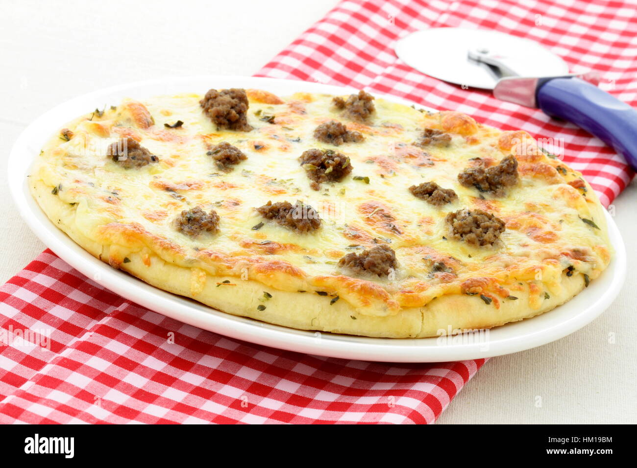 delicious rustic meat pizza topped with mozzarella cheese,ground beef ...