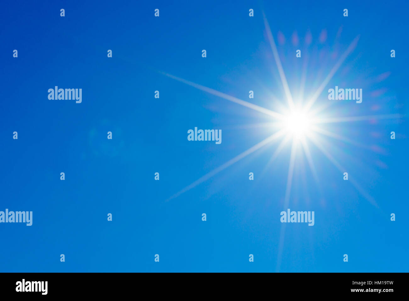 Blue sky with sun Stock Photo - Alamy
