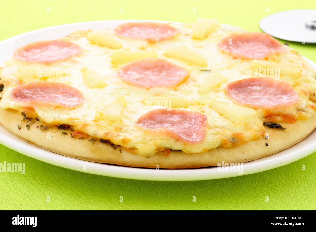 delicious hawaiian rustic style pizza made with fresh pineapples,ham ...