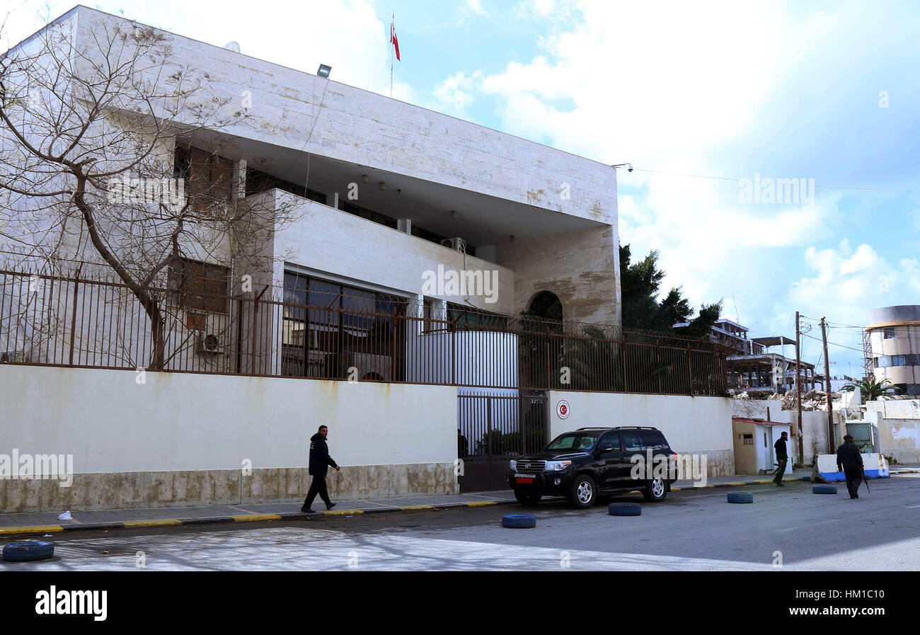 Tripoli, Libya. 30th Jan, 2017. Security members stand guard outside ...