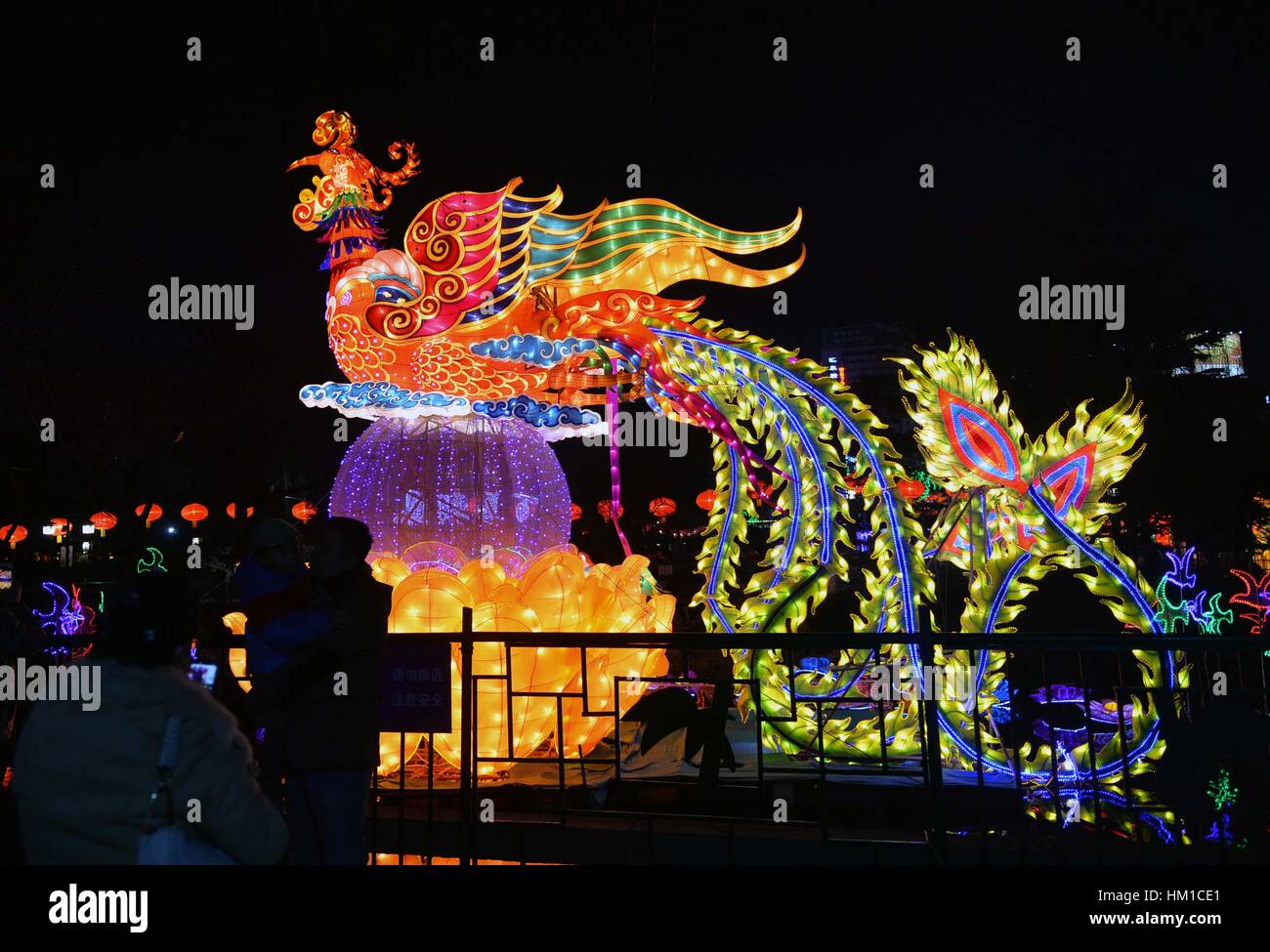 Jinan, China. 30th Jan, 2017. Tourists visit the 38th Baotu Spring ...