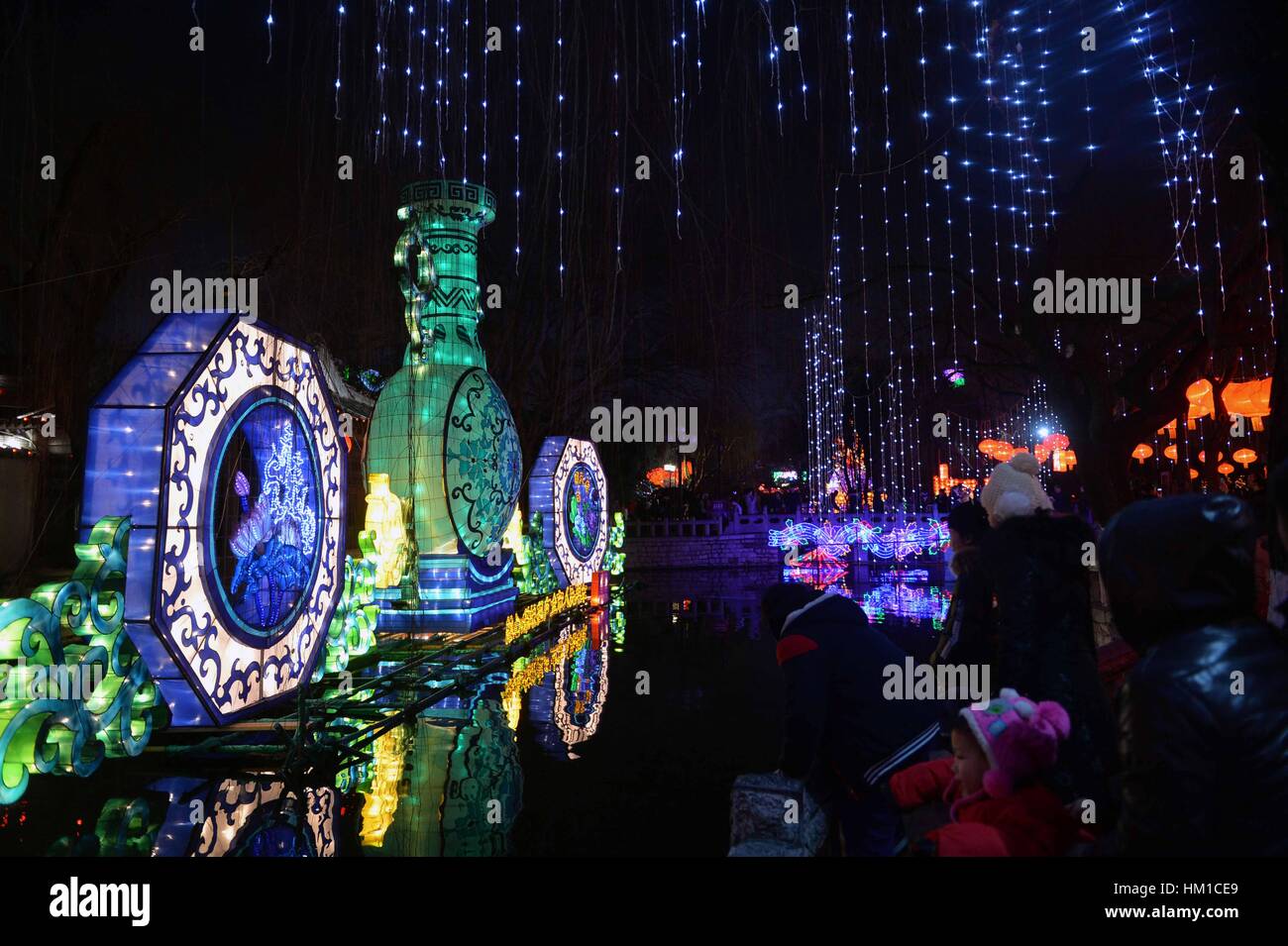 Jinan, China. 30th Jan, 2017. Tourists visit the 38th Baotu Spring ...