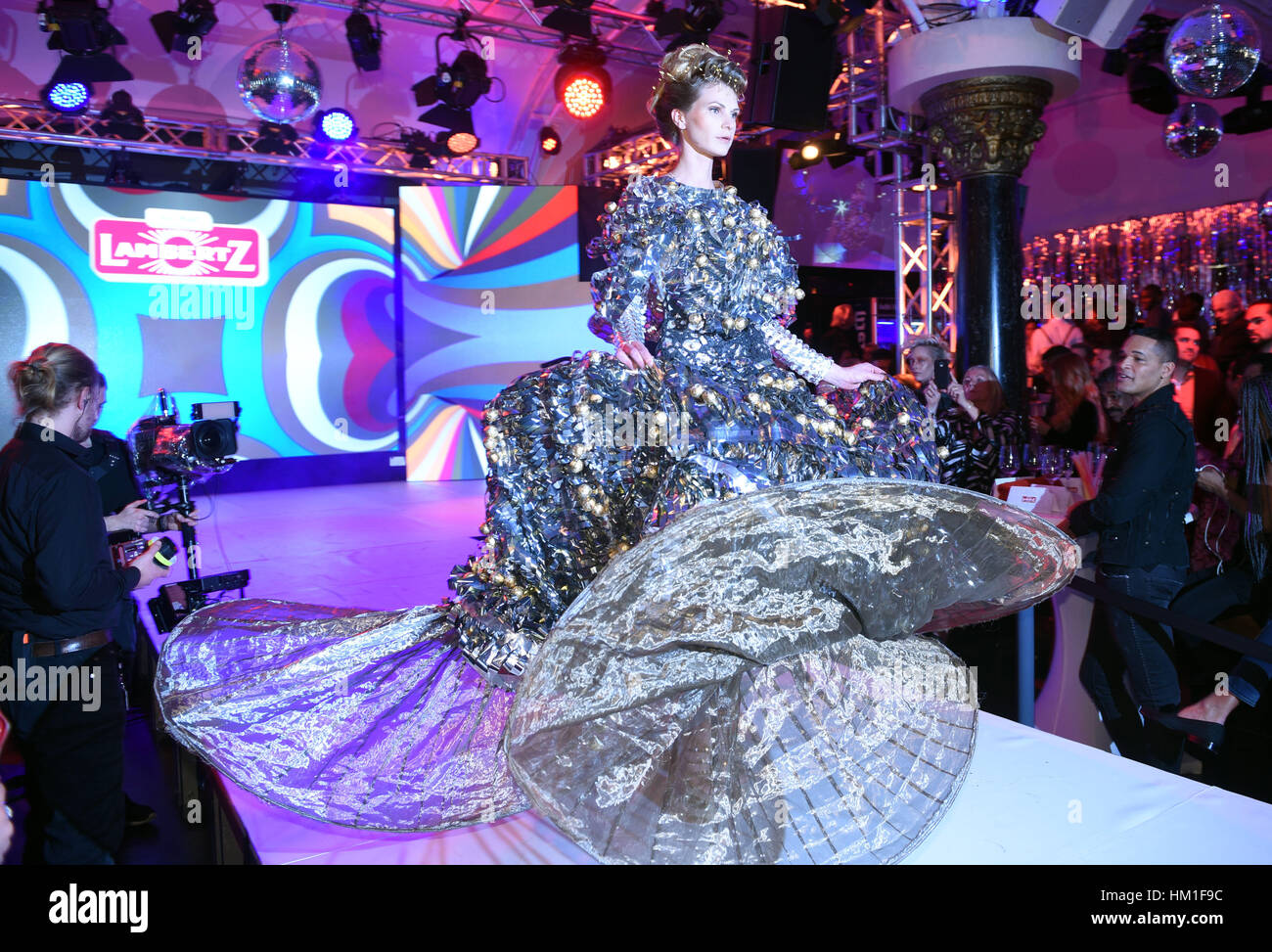 Cologne, Germany. 30th Jan, 2017. A model presents a chocolate dress at ...