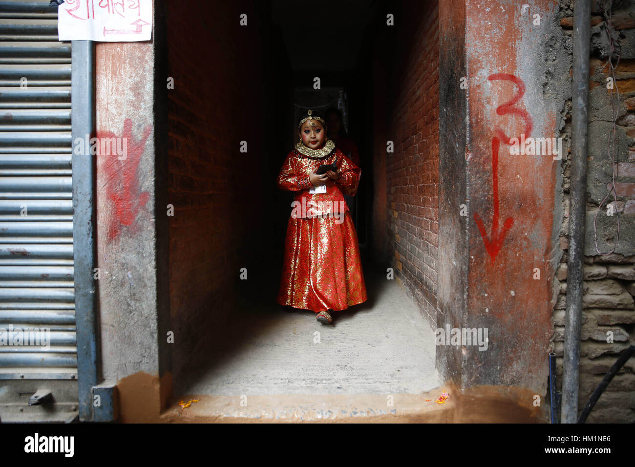 Kathmandu, Nepal. 1st Feb, 2017. A Nepalese Newar girl walks to take ...