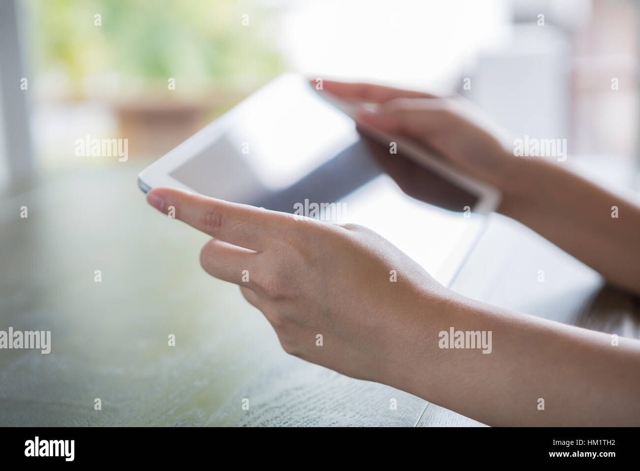 Woman hand touch white tablet with blank empty screen Stock Photo - Alamy