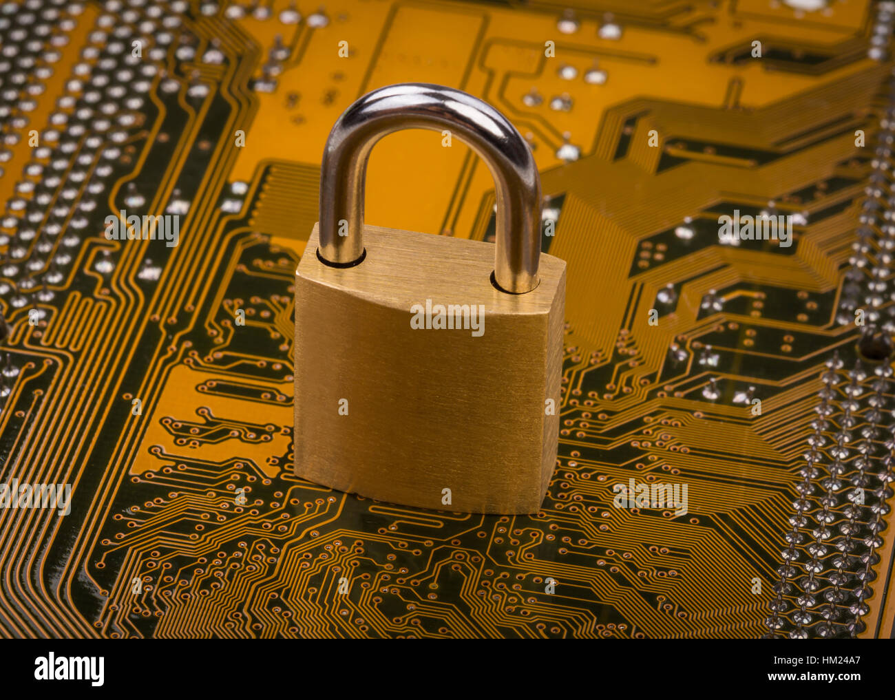 Protection concept : security lock on computer circuit board Stock ...