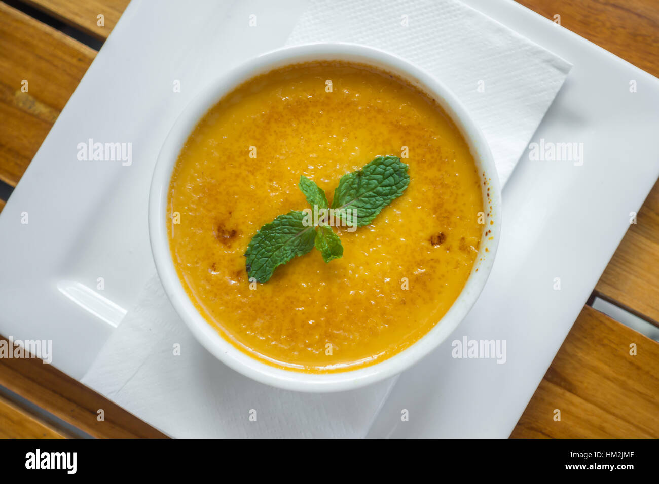 Custard pudding in white plate Stock Photo - Alamy