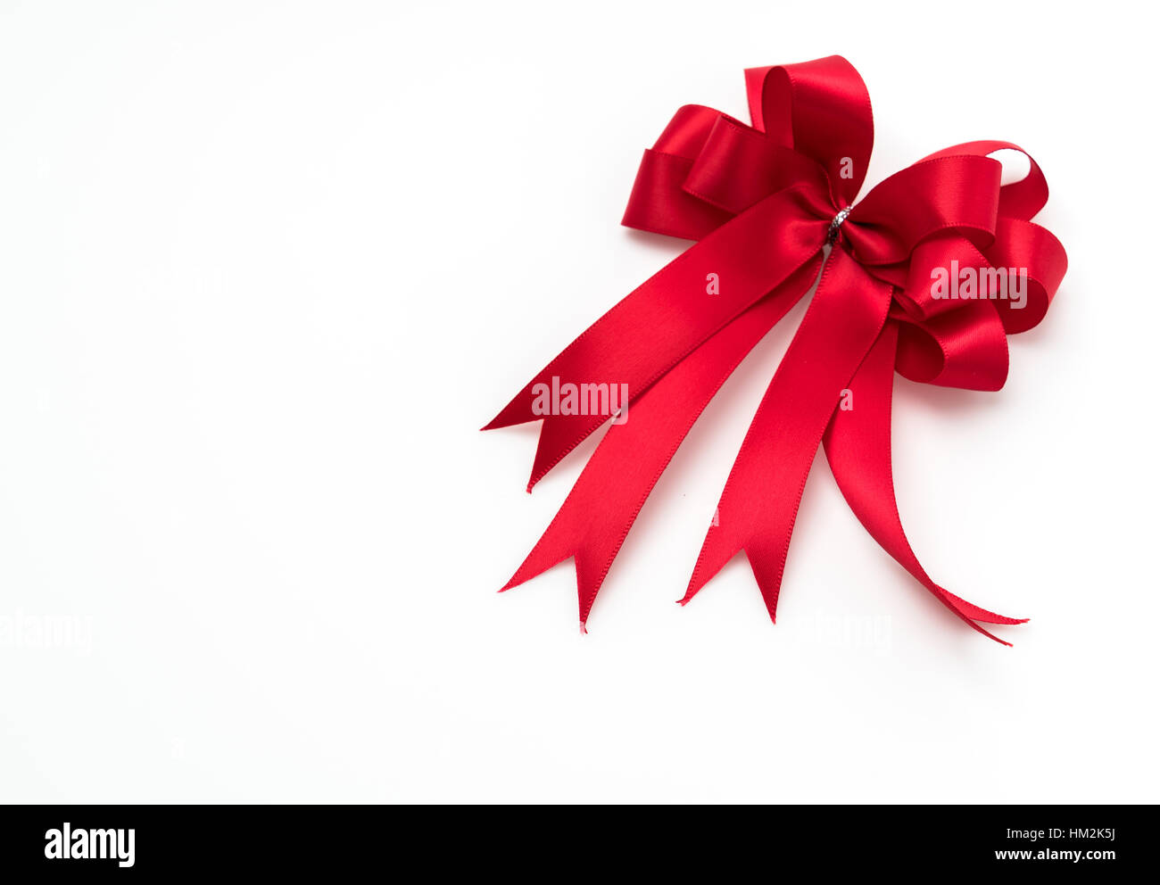 Shiny red ribbon on white background with copy space Stock Photo - Alamy