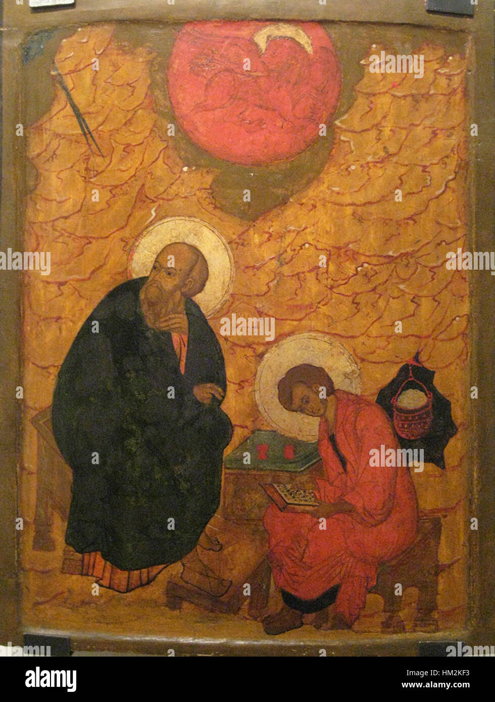 This religious artwork, titled 'John at Patmos', depicts the Apostle ...