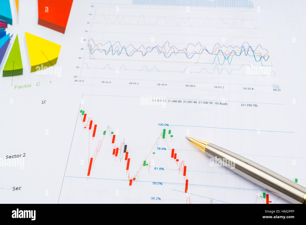 Financial charts with pen Stock Photo - Alamy
