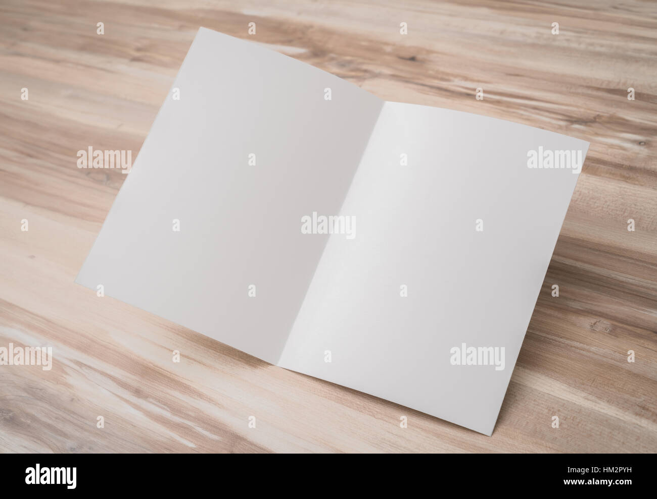 Bifold white template paper on wood texture Stock Photo - Alamy