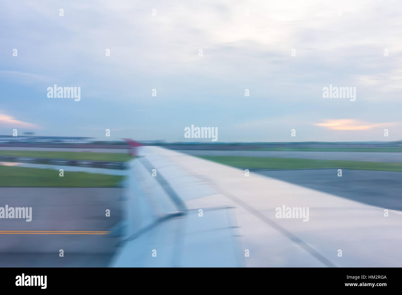 Wing while breaking during landing on runway Stock Photo - Alamy