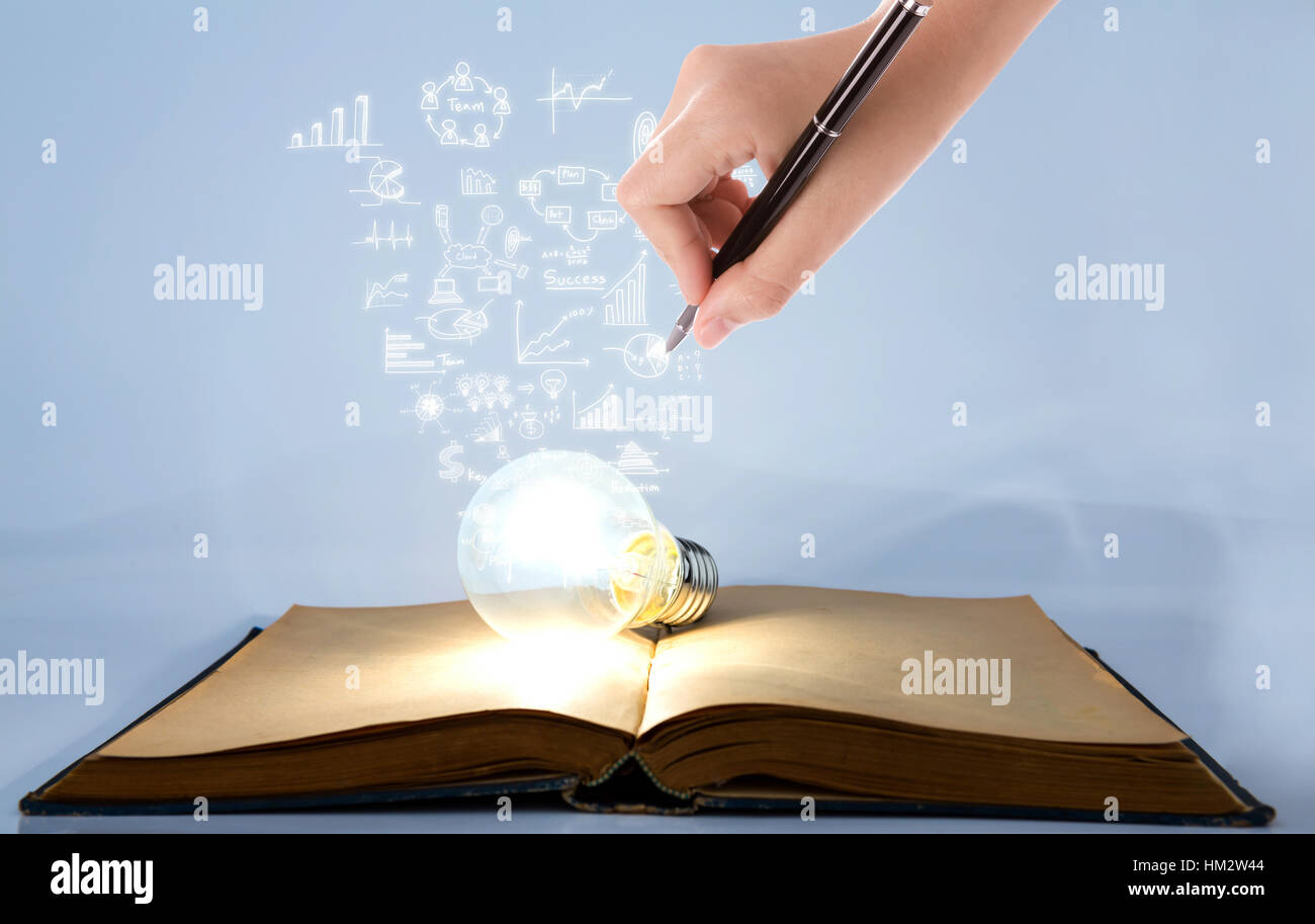 Book and light bulb with hand drawing graph Stock Photo - Alamy