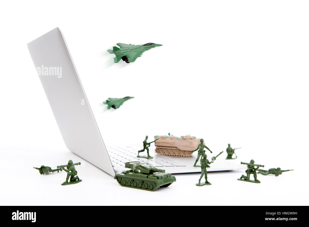 Computer security concept : soldiers,tank,plane are guarding a laptop ...