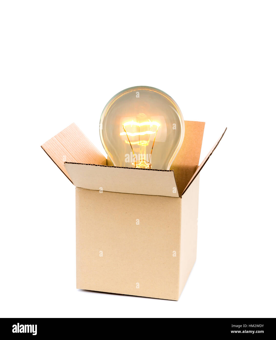Glowing light bulb over open cardboard box Stock Photo - Alamy