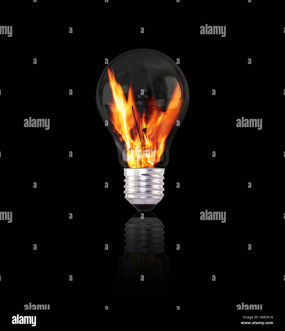 light bulb with fire on black background Stock Photo - Alamy