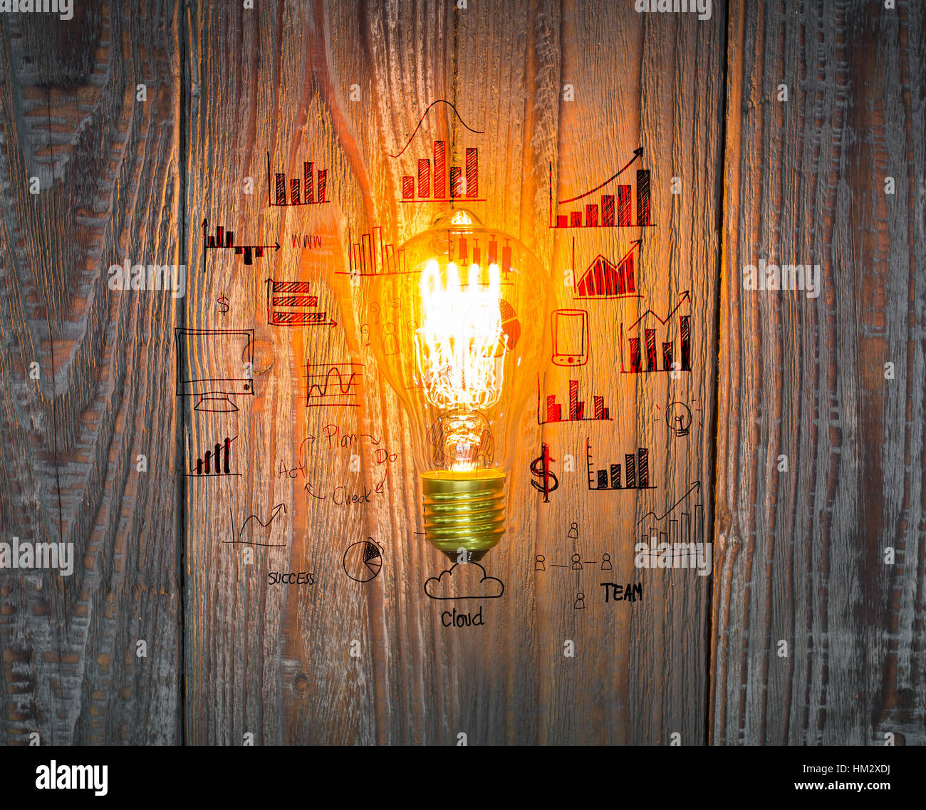 Glowing bulb with drawing graph on the wood background Stock Photo - Alamy