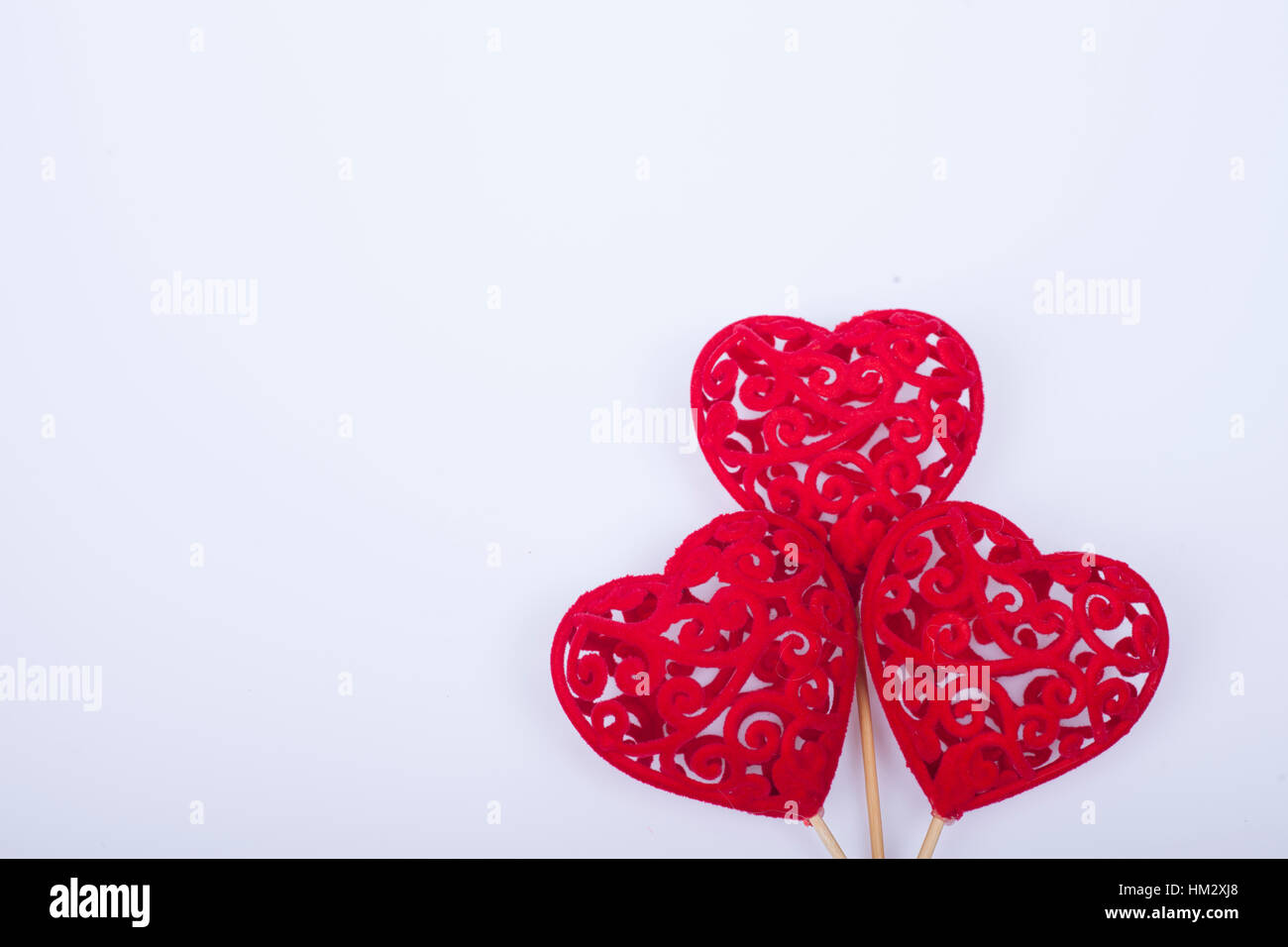 Three beautiful red hearts on a white background Stock Photo - Alamy