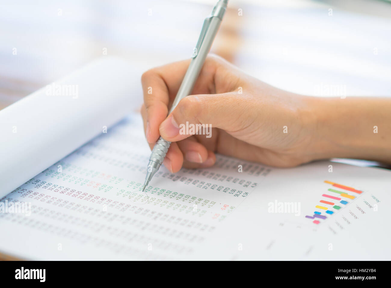 Hand write on Various financial charts on the table Stock Photo - Alamy