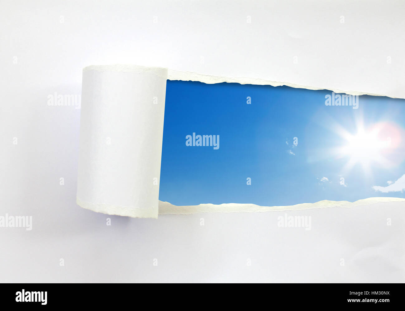 Ripped paper and blue sky Stock Photo - Alamy