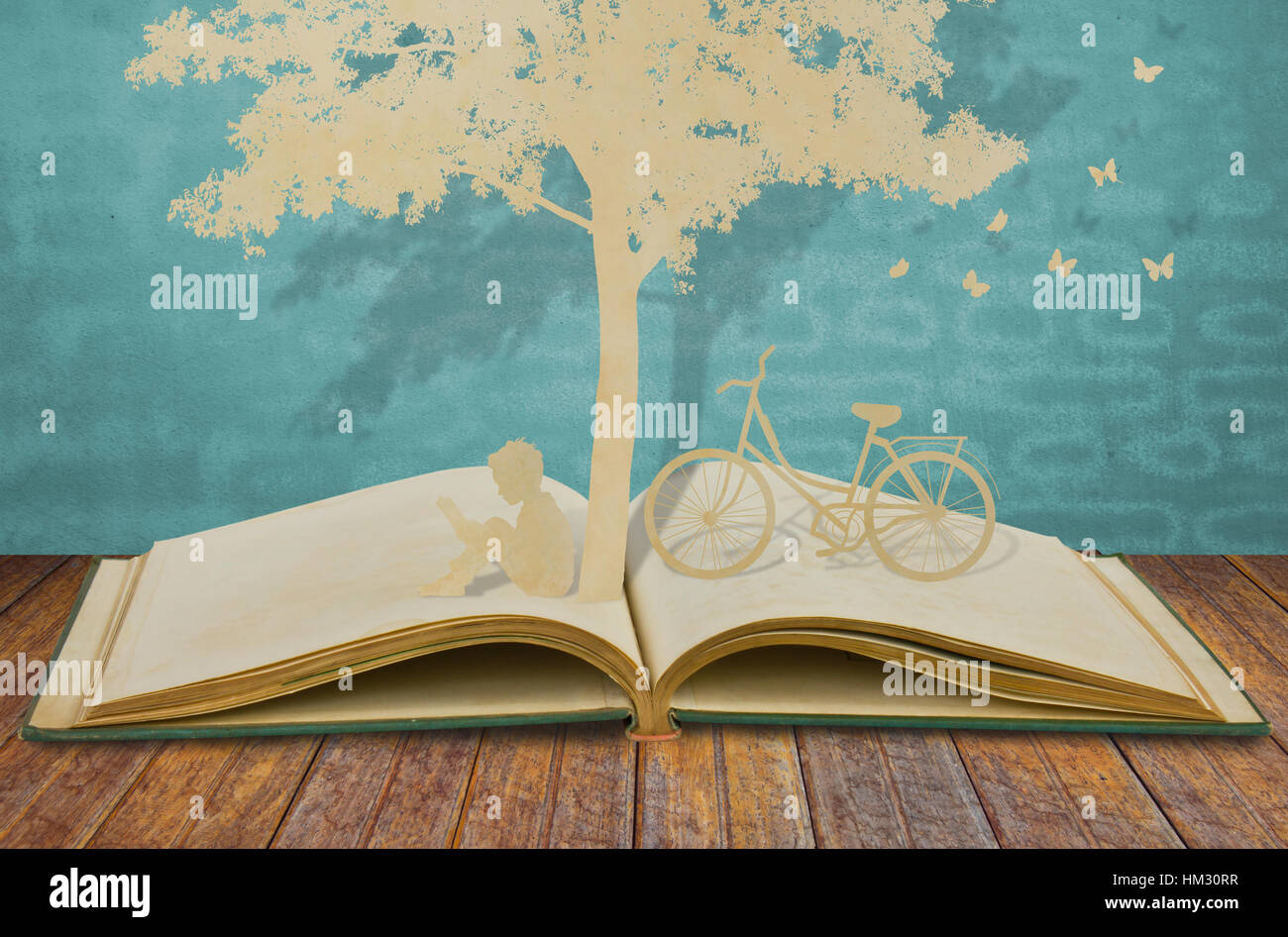 Children reading books under tree hi-res stock photography and images ...