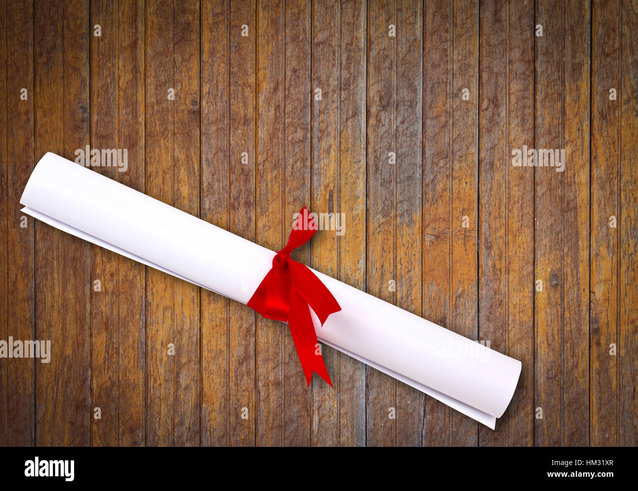 Diploma wrapped with a red ribbon on white background Stock Photo - Alamy