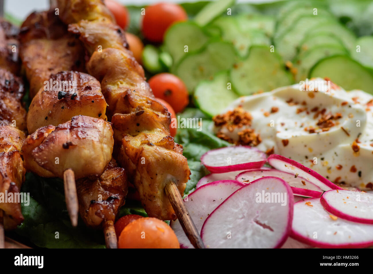 Chicken kebab with homemade yogurt and vegetables Stock Photo - Alamy