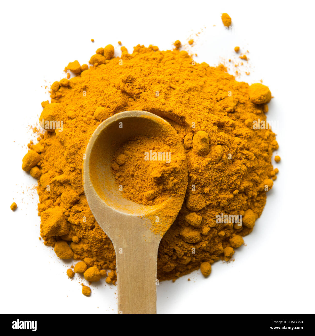 Pile of turmeric on white background with wooden measuring spoon Stock ...