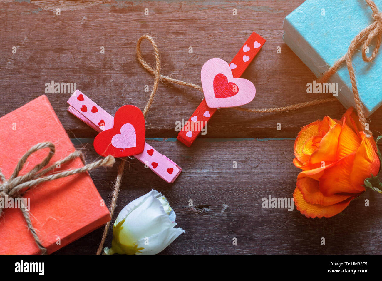 Gift boxes and hearts on old wood Stock Photo - Alamy