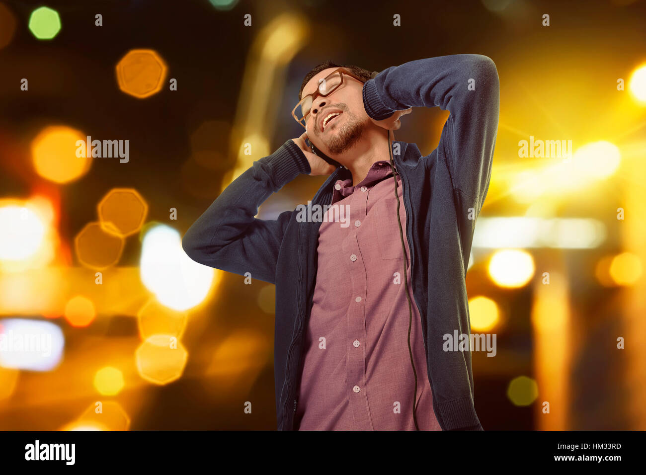 Asian man listening music hi-res stock photography and images - Alamy