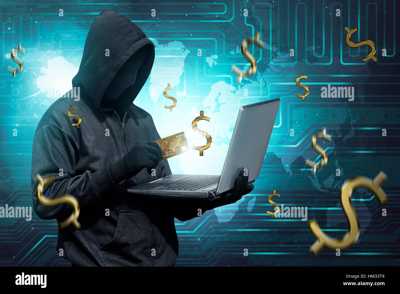 Hacker man with mask holding credit card with laptop on his hand on ...