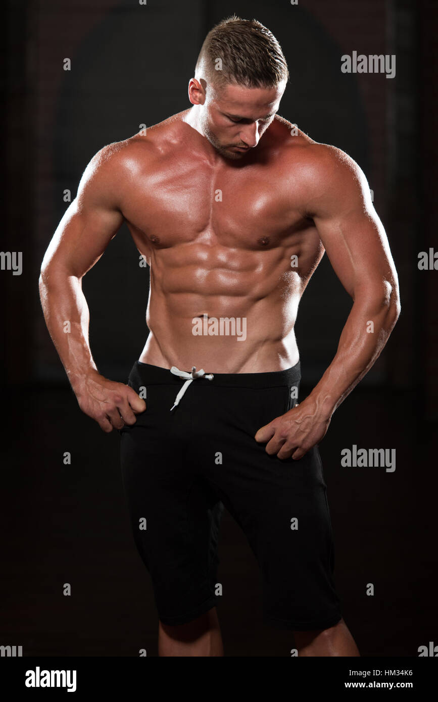 Portrait Of A Young Physically Fit Man Showing His Well Trained Body ...