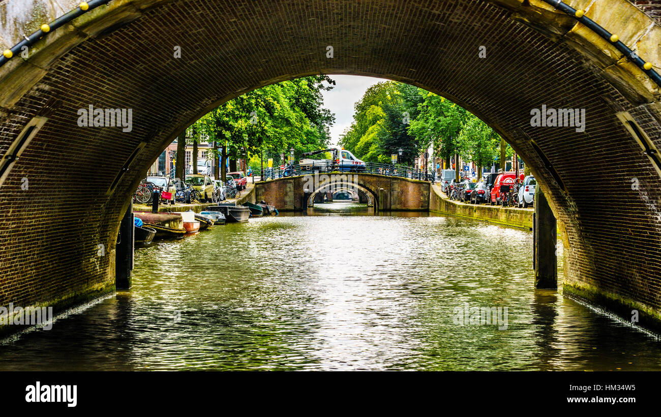 Series of bridges in a perfectly straight line over a canal in the ...