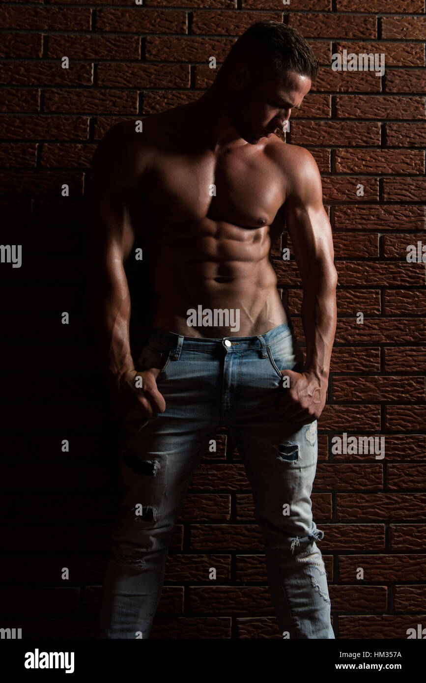 Portrait Of A Young Physically Fit Man Showing His Well Trained Body ...