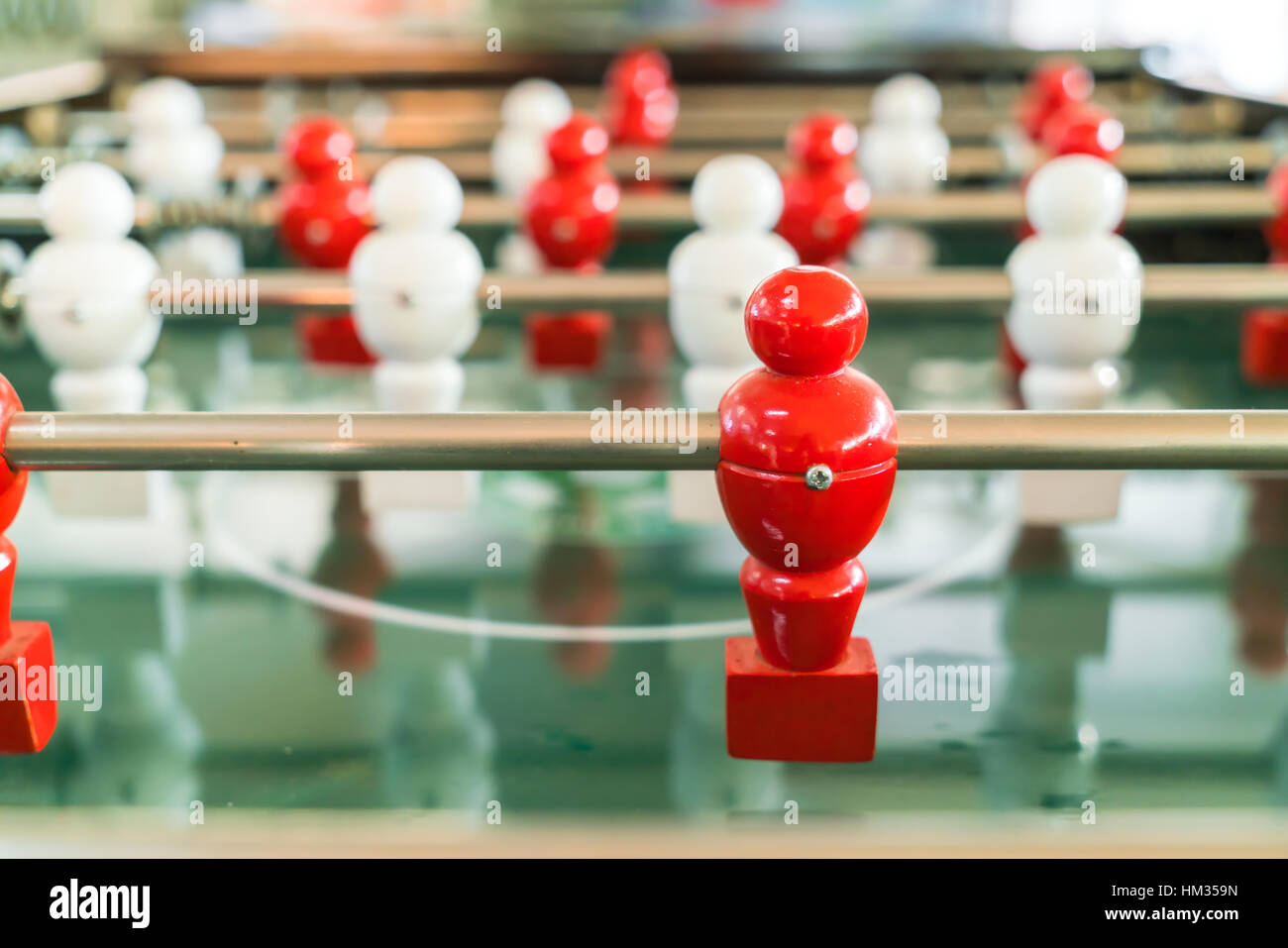 Football table game with red and white player Stock Photo - Alamy